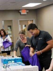 RLT Packs 300 Backpacks for Massie’s Mobile Mission | Luther Automotive